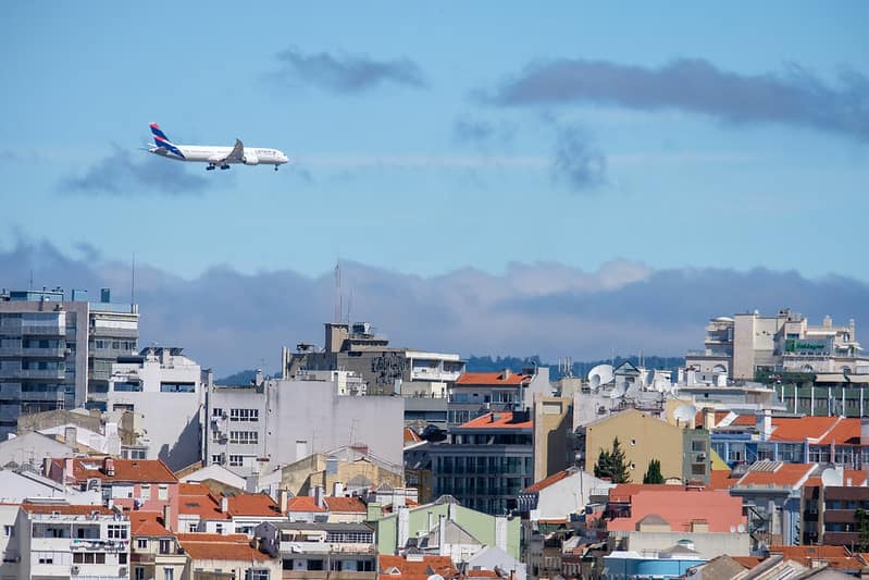 Airplane Flying Over City Photo | Download free images from Mystock